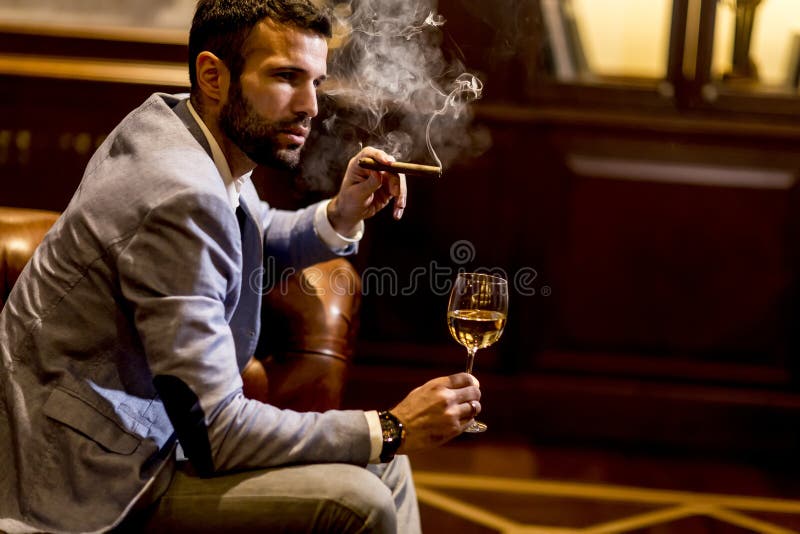 Man Tasting White Wine and Smoking Cigar Stock Image - Image of serious ...