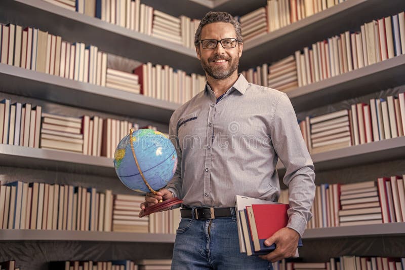 Man Teacher in Classroom. School Lesson. Teacher at School Classroom ...