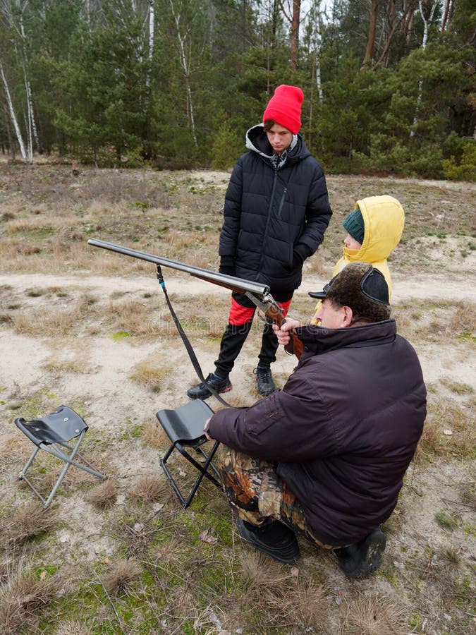 Man Teaches Children Shooting with Hunting Rifle Stock Photo - Image of ...