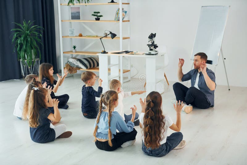 Man Teaches Gesture Language. Group of Children Students in Class at ...