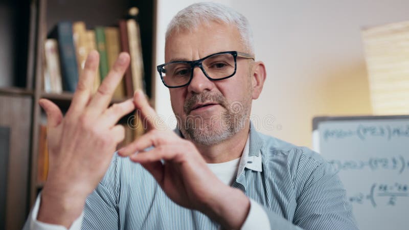 Elderly Man Discussing Mathematics during Online Lecture Stock Footage ...
