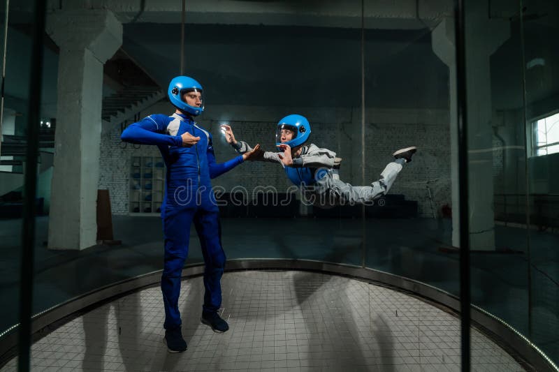 A Man Teaches a Woman How To Fly in a Wind Tunnel. Free Fall Simulator ... A Man Teaches a Woman How To Fly in a Wind Tunnel. Free Fall Simulator ...