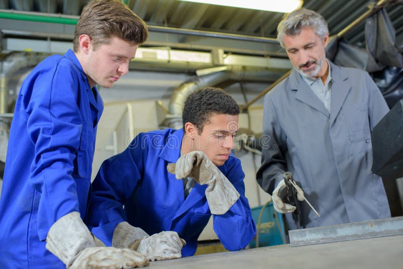 Man Teaching Students To Weld Stock Image - Image of safety, heat ...