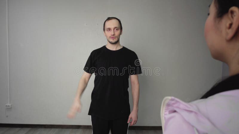 Man Teaching Young Woman Hip Hop Movement at Dancing Class. Young ...