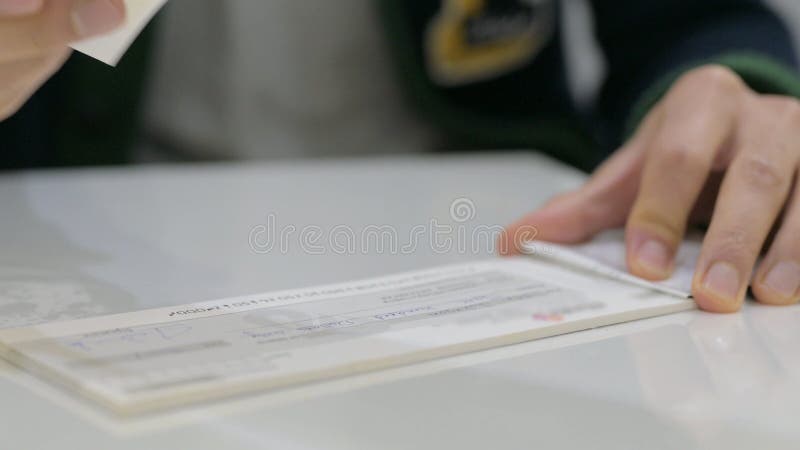 The Man Tearing and Offer a Bank Cheque Stock Footage - Video of ...