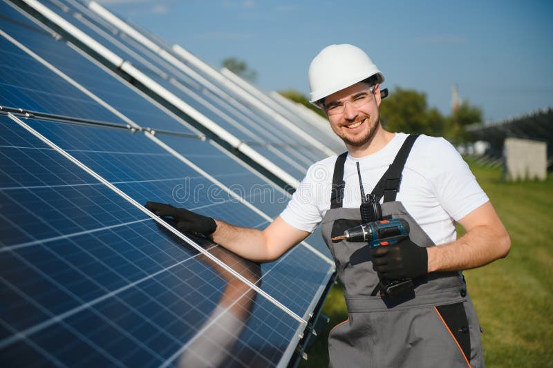 Man Technician Mounting Photovoltaic Solar Moduls. Engineer in Helmet ...