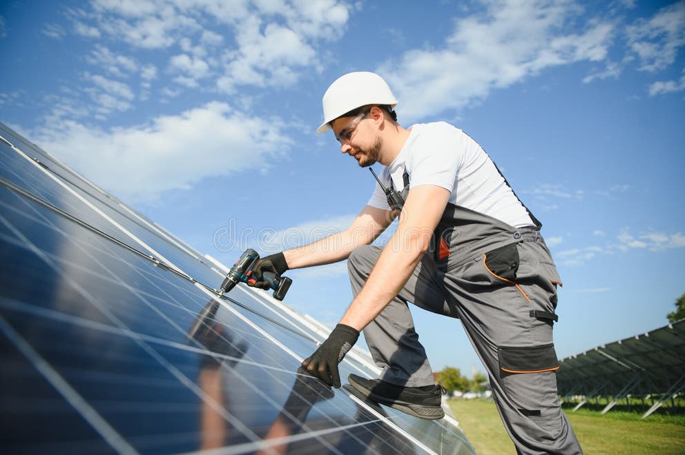 Man Technician Mounting Photovoltaic Solar Moduls. Engineer in Helmet ...