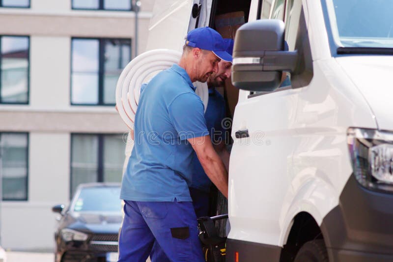 Man and Technician Outside Fixing Cable Stock Photo - Image of ...
