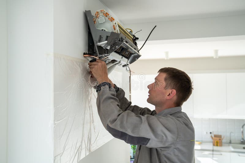 Man Technician Repairing Apartment Air Conditioner Stock Image - Image ... Man Technician Repairing Apartment Air Conditioner Stock Image - Image ...