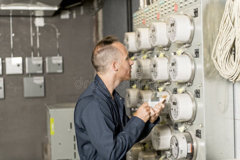 Man Technician Servicing at Work on Electric Room Stock Image - Image ...