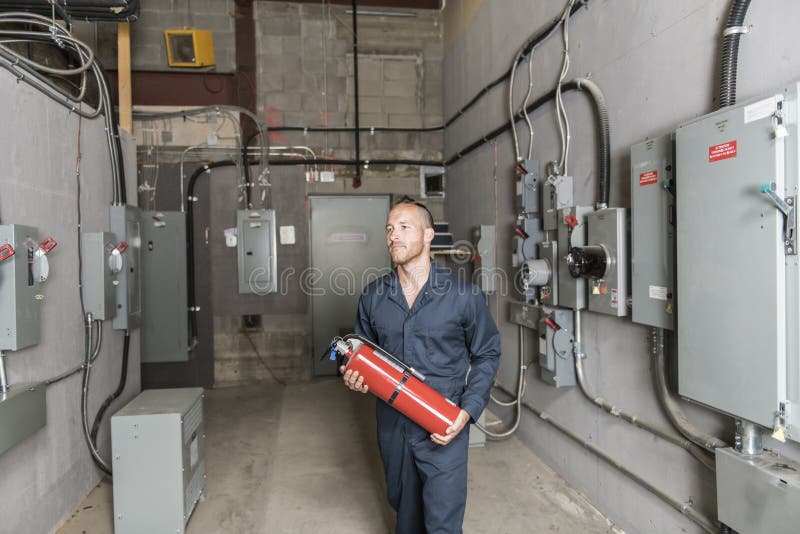 Man Technician Servicing at Work on Electric Room Stock Photo - Image ...
