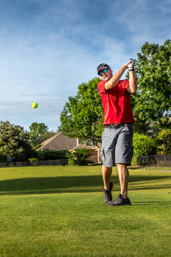Man Teeing Off in the Tee Box, Playing Golf Stock Image - Image of ...