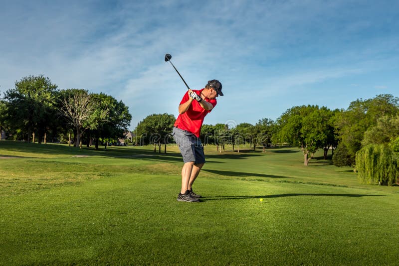 Man Teeing Off in the Tee Box, Playing Golf Stock Image - Image of ...