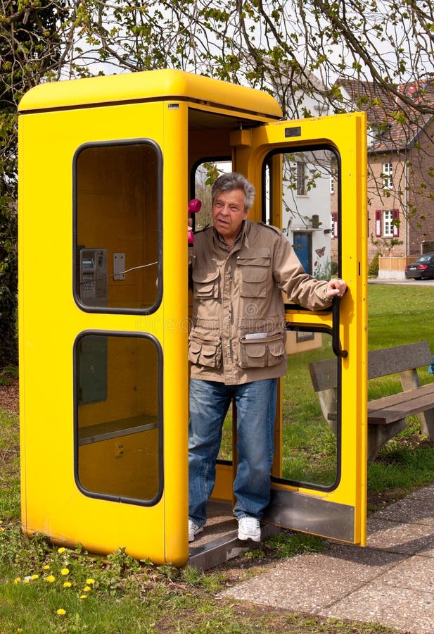 Man in telephone booth stock image. Image of home, bench - 25426997