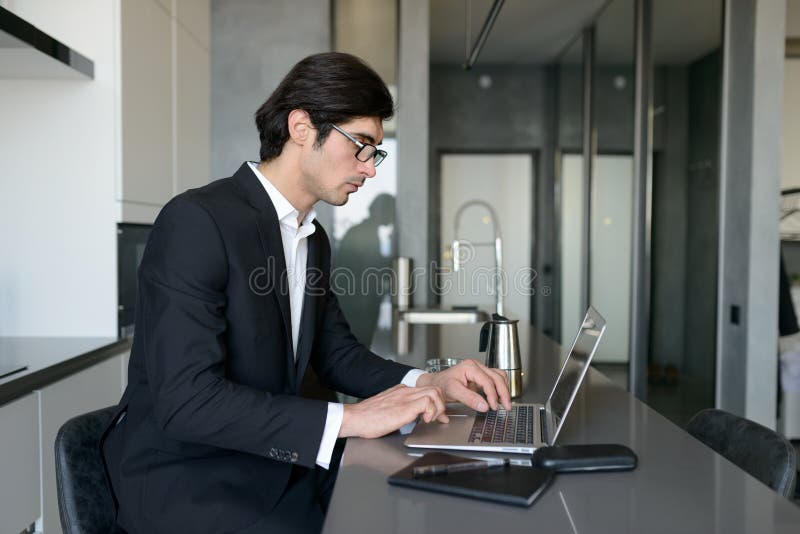 Man Teleworker Works at Home with a Laptop Stock Image - Image of ...