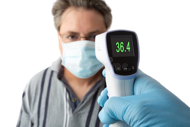 A Man is Temperature Checked for Fever or High Temperature Stock Photo ...
