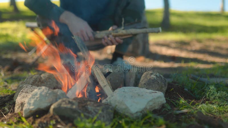 Survival Skills in Action Man Tends To a Cozy Wilderness Campfire Stock ...