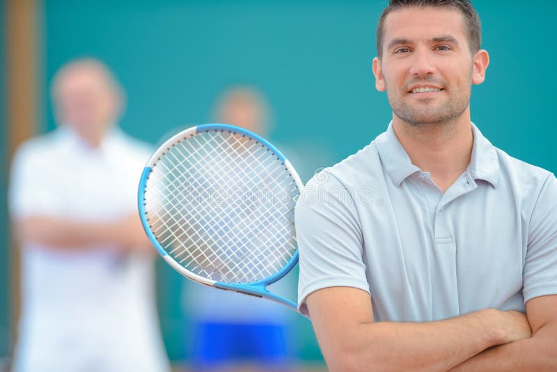 Man with tennis racket stock image. Image of activity - 265787619