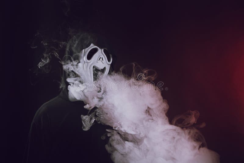 Man in a Terrible Mask and Black Cloak Vape Stock Image - Image of ...