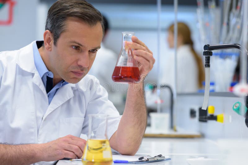 Man Test Tubes and Flasks Table Stock Image - Image of studying ...