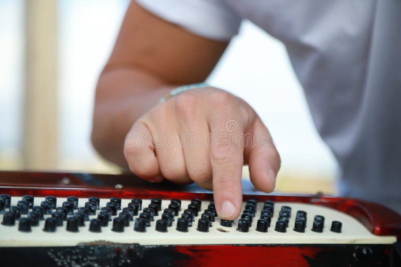 Man Testing All the Buttons of His Accordion Stock Photo - Image of ...