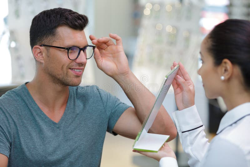Man Testing Glasses in Optician Shop Mirror Stock Photo - Image of ...