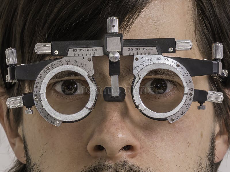 Man is Testing Glasses Trial Frame at Optometrist Doctor. Stock Photo ...