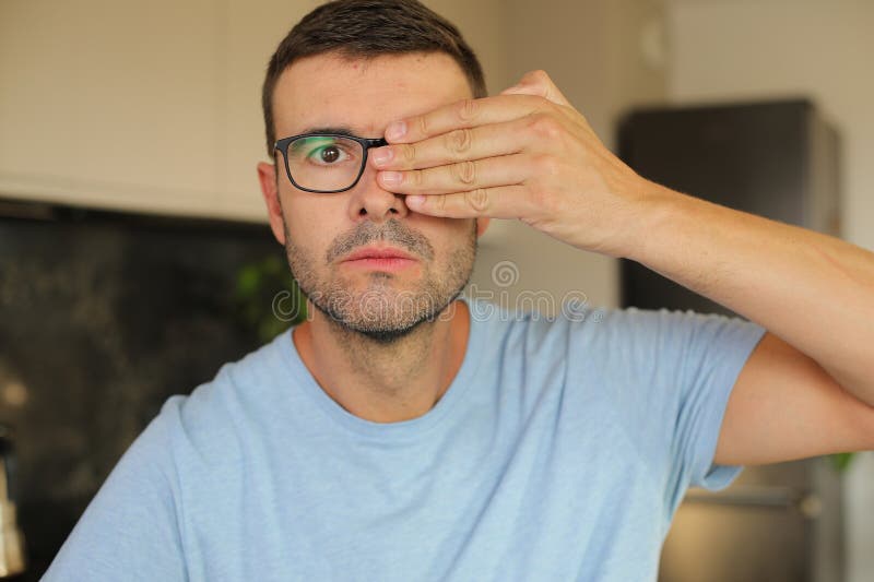 Man testing his own vision stock image. Image of tool - 329478199