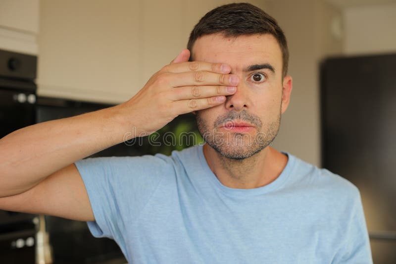 Man testing his own vision stock image. Image of text - 329478207
