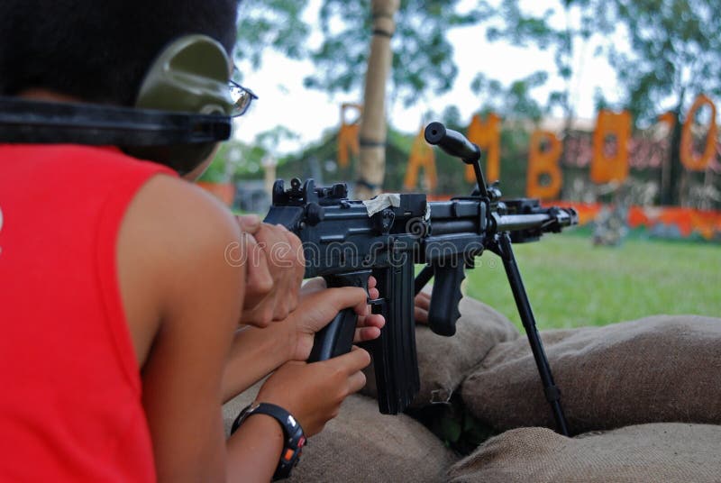 Man Testing the Machine Gun Stock Photo - Image of bullet, firing: 3107052
