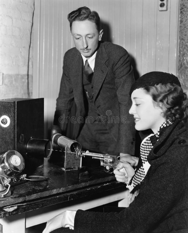 Man Testing Womans Aim with Gun Stock Image - Image of formal, aiming ...