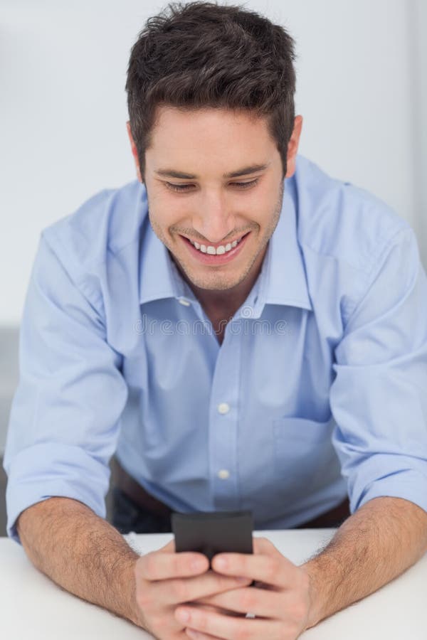 Man Text Messaging with His Smartphone Stock Photo - Image of handsome ...