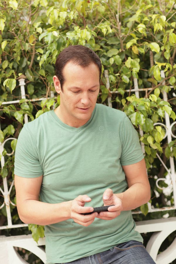 Man texting stock image. Image of phone, text, green - 19262035