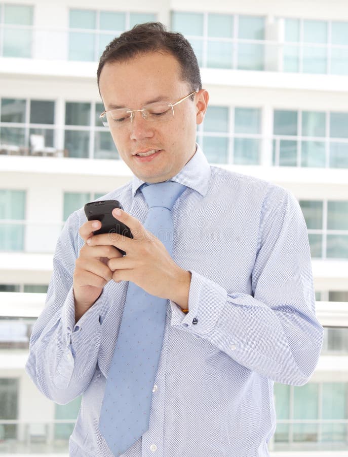 Man Texting through Cellphone Stock Image - Image of natural ...