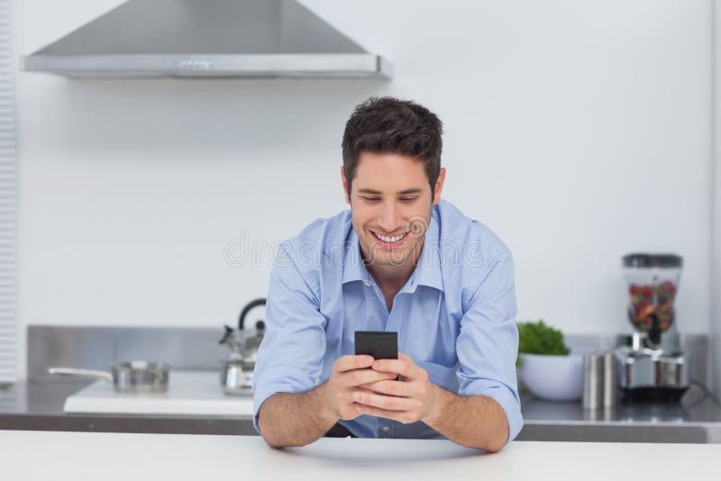 Man Texting with His Smartphone Stock Photo - Image of standing ...