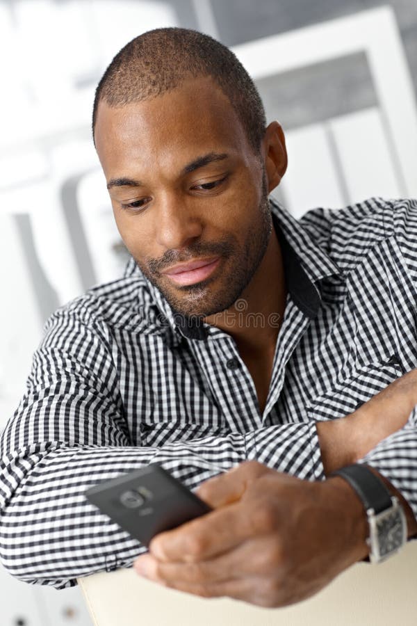 Man Texting on Mobile Phone Stock Photo - Image of goodlooking ...