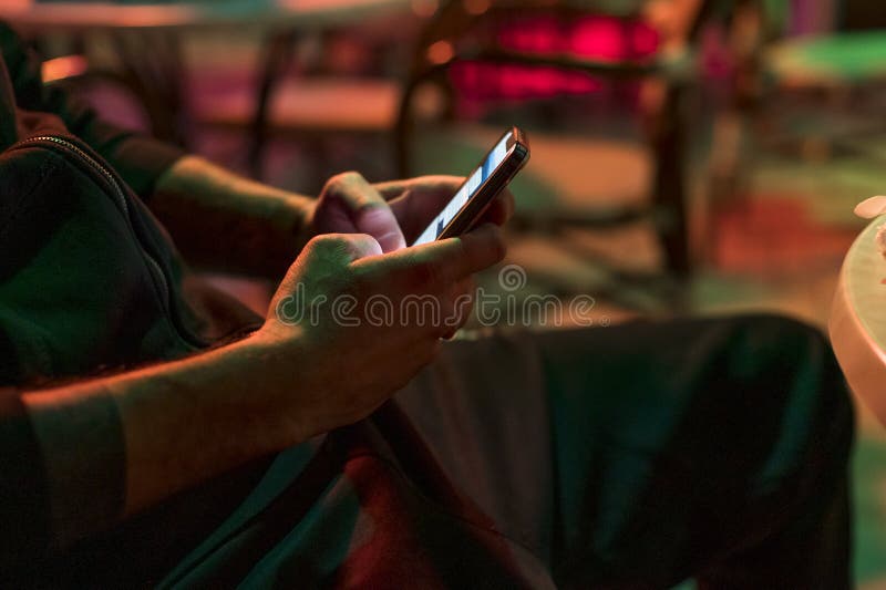 Man Texting on the Phone in the Club Stock Photo - Image of ...