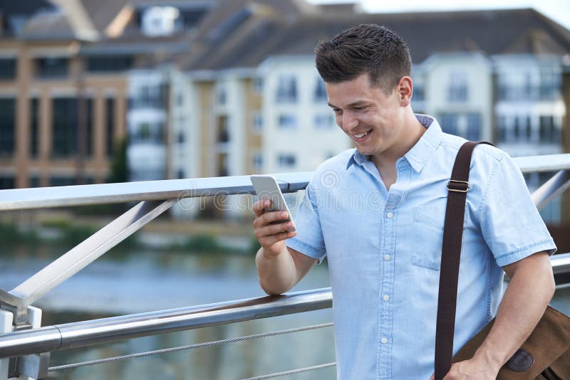 Man Texting on Mobile Phone on Way To Work Stock Photo - Image of male ...