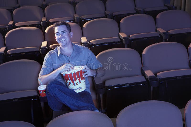 Man in Theater Watching Movie Stock Photo - Image of caucasian, indoors ...