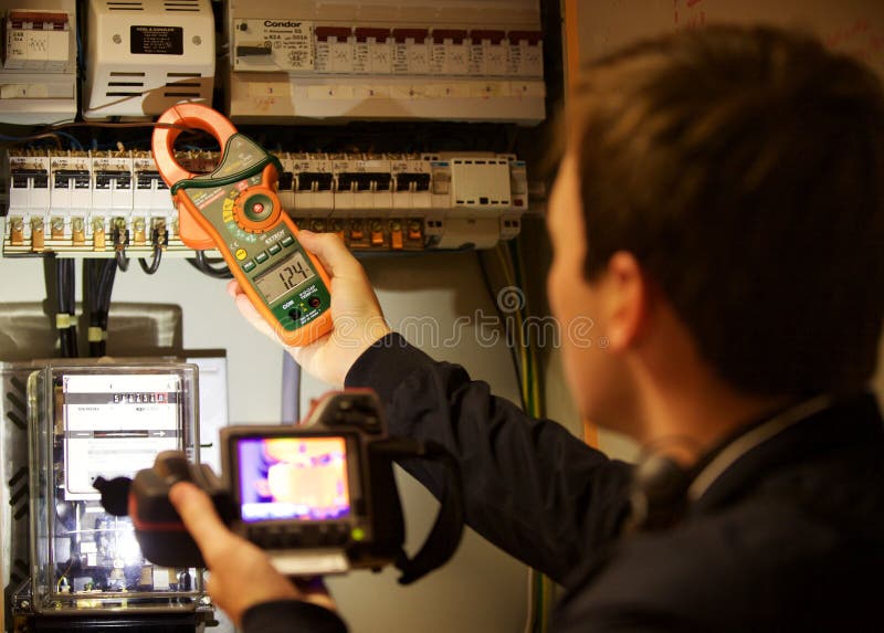 Man with Thermal Imaging Camera Checking Electric Installation with an ...