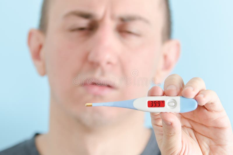 Man with a Thermometer in His Hand. Increased Body Temperature Stock ...