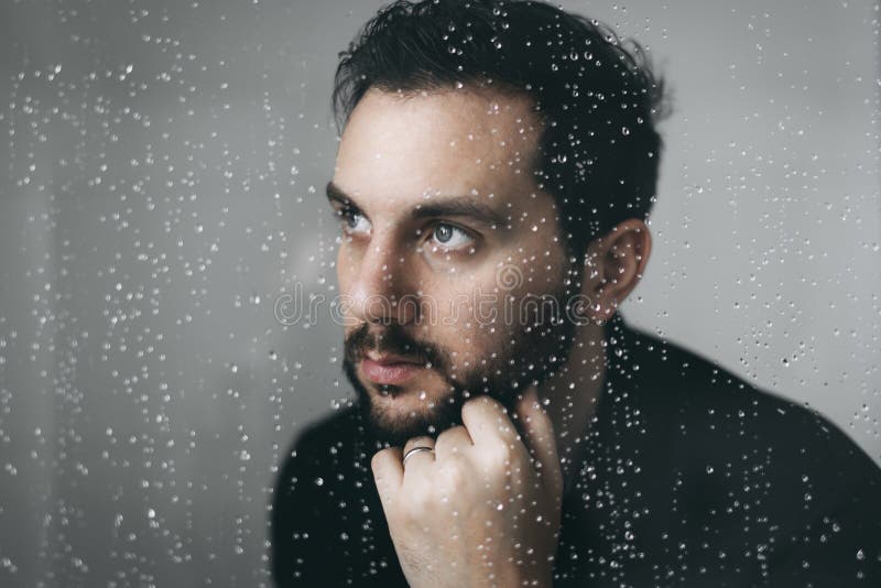 Man Thinking and Anxious Behind a Rainy Window Stock Photo - Image of ...