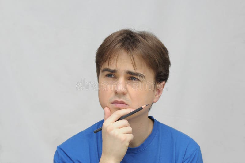Man thinking with pencil stock photo. Image of pencil - 38669306