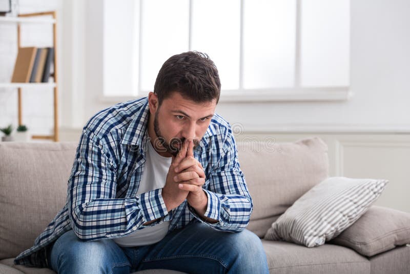 Man Thinking about Problem Solution, Sitting on Sofa Stock Image ...