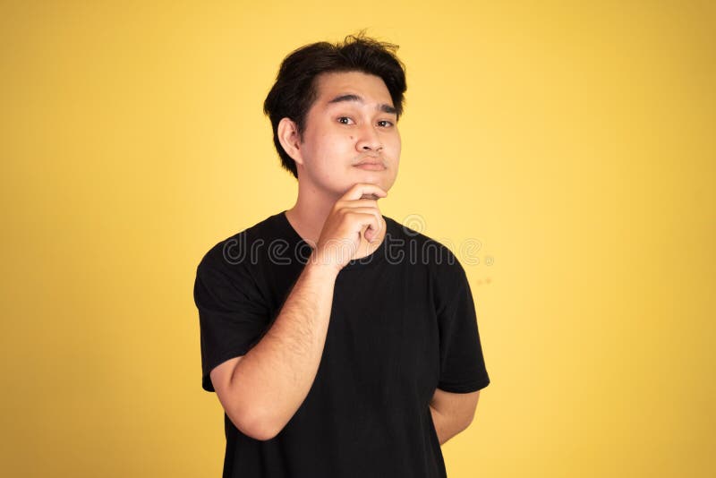 Man Thinking Something and Looking at the Camera and Hand on Chin Stock ...