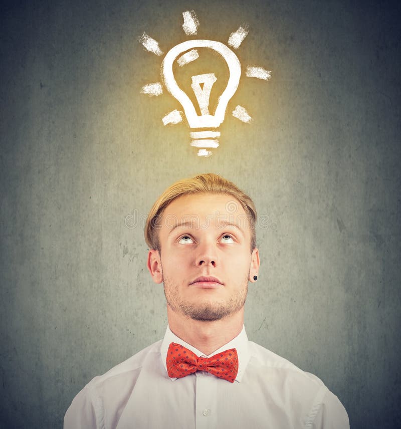 Man with Thoughtful Expression and Bright Light Bulb Over His Head ...