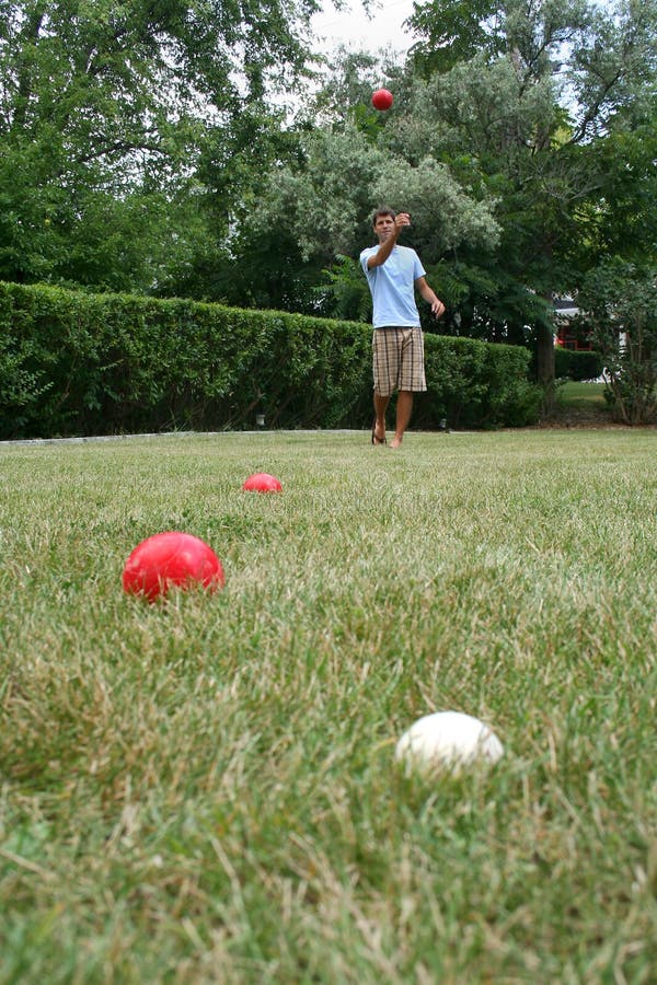 Man Throwing Balls stock photo. Image of yard, playground - 7209202