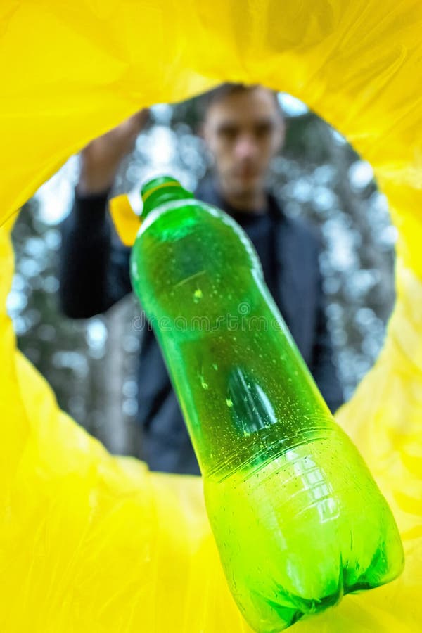 Man Throwing a Bottle into a Trash Can Stock Image - Image of bottle ...