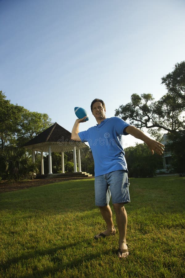 Man throwing football. stock image. Image of color, caucasian - 2051713