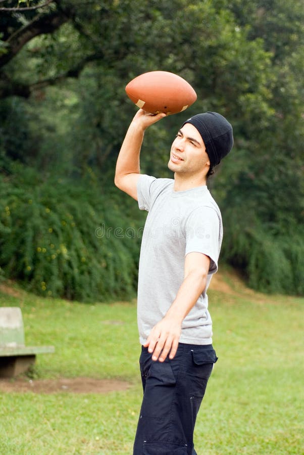 Man Throwing Football - Vertical Picture. Image: 5579979